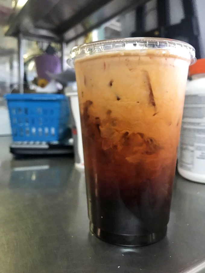 Homemade Thai tea swirling with creamy richness. Like a sunset in a cup, it's the unexpected plot twist in this all-American story.