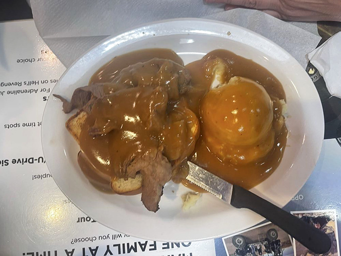 The hot beef sandwich&mdash;where gravy isn't just a condiment, it's a lifestyle choice. This plate understands that some days, you need food that hugs you back.