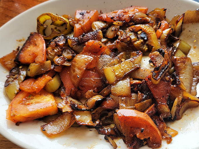 The hot pepper salad isn't just a side dish&mdash;it's a flavor explosion that cuts through richness like Sinatra cuts through a crowded room.