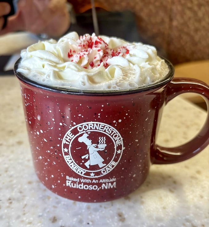 Their signature mug doesn't just hold hot chocolate—it cradles a mountain of whipped cream that's practically begging for an avalanche of spoons.