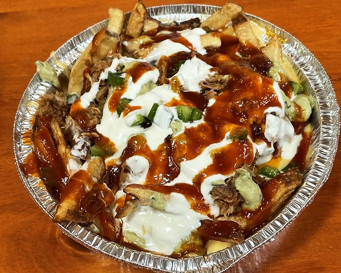 The "Hot Mess" lives up to its name gloriously&mdash;fries, pulled pork, cheese sauce, and zero regrets. Diet starts tomorrow.