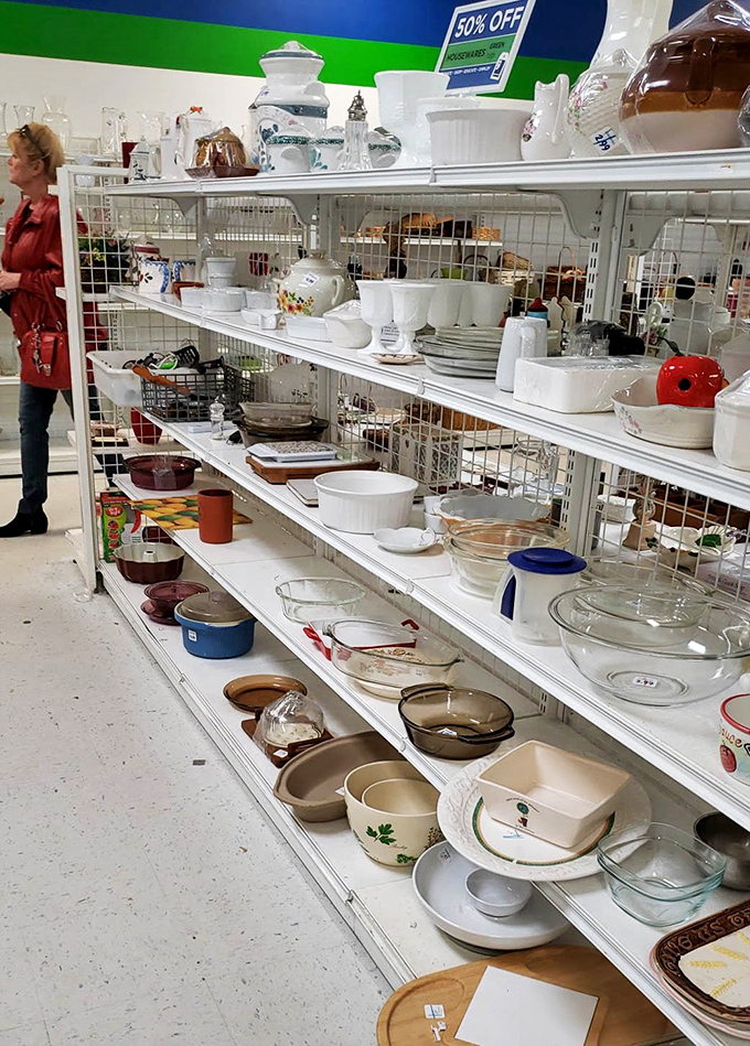 Pyrex patterns your grandmother would recognize line these shelves like a museum of American kitchen history.