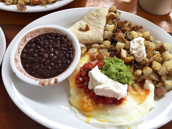 A Mexican-inspired breakfast fiesta where eggs, beans, potatoes, and avocado gather for a morning party that puts cereal to shame.