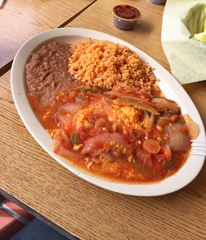 Huevos Rancheros: where eggs meet their destiny atop a throne of tortillas, swimming in a sauce worth setting your alarm for.