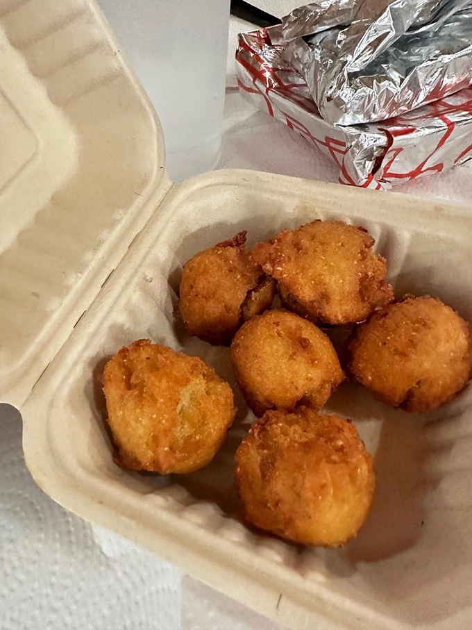 Hush puppies: golden-brown orbs of cornmeal joy that somehow manage to be both crispy and tender. The South's greatest contribution to finger food.