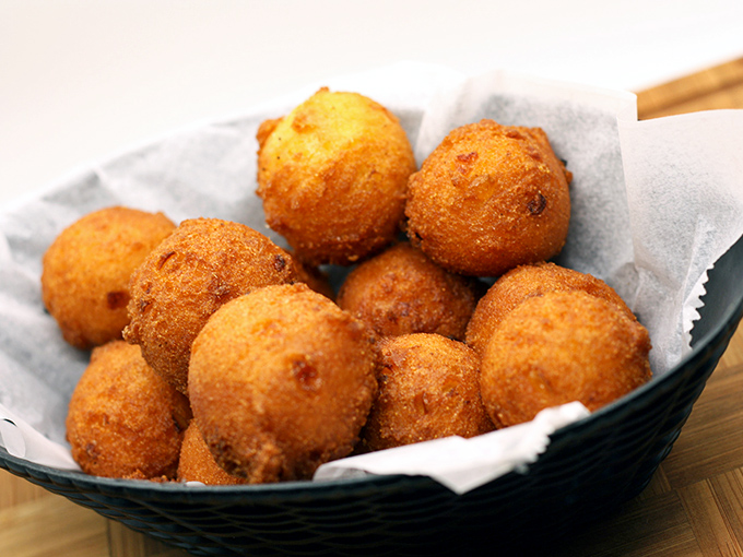 Hushpuppies so golden they deserve their own trophy case. These little cornmeal spheres of joy are what happens when dough fulfills its destiny.