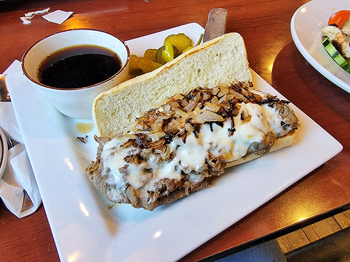 An Italian beef sandwich that doesn't need Chicago's permission to be magnificent. Tender meat, melted cheese, and that essential au jus for dipping.