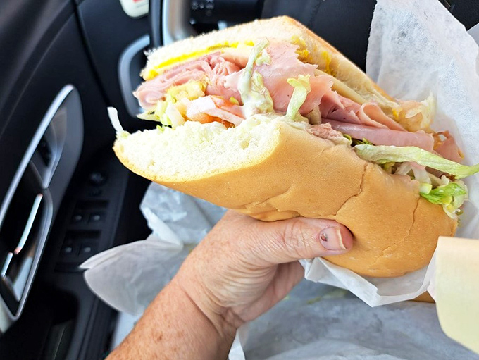 The Italian sub in its natural habitat &ndash; the car console &ndash; ready to deliver a symphony of meats, veggies, and bread to a lucky diner.