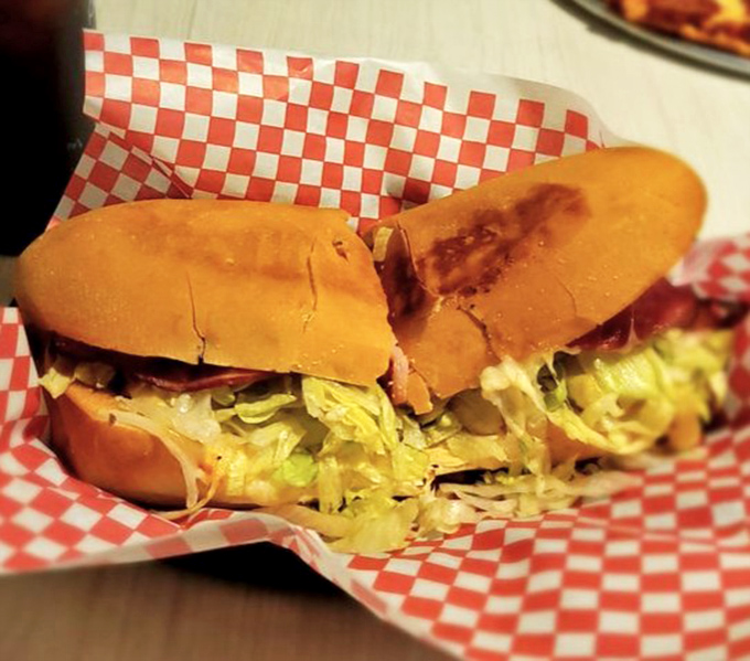 The Italian sub arrives like an edible work of art &ndash; layers of meat, cheese, and veggies nestled in a roll that's both soft and sturdy.