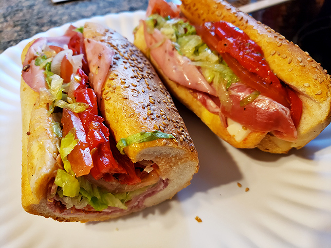 This Italian hoagie showcases the architectural brilliance of proper sandwich construction&mdash;layers of meat, those roasted red peppers, and just enough oil to make your mouth water.