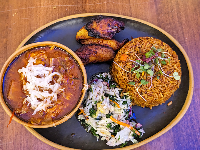 This Jollof rice plate is the comfort food you never knew you needed &ndash; rich, aromatic, and topped with enough sides to keep your fork dancing.