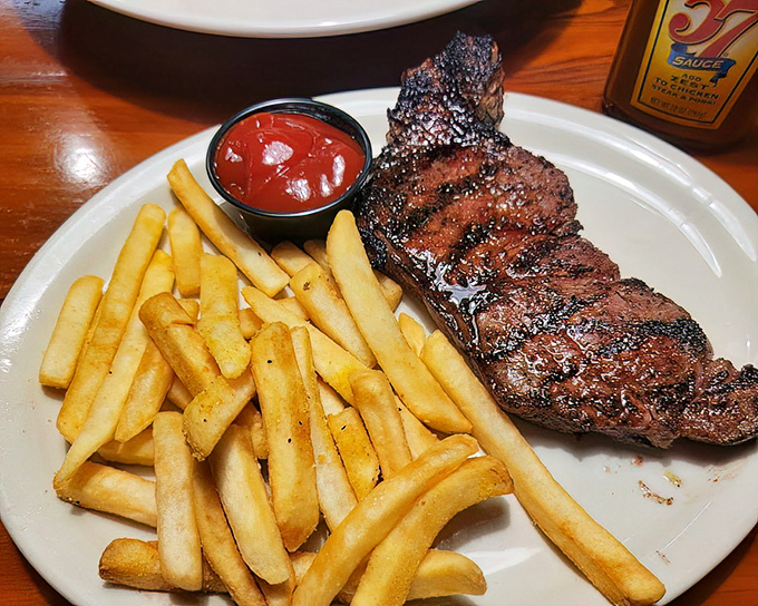 Simplicity at its finest: perfectly grilled steak alongside golden fries. Sometimes the classics become classics because they're simply unbeatable.