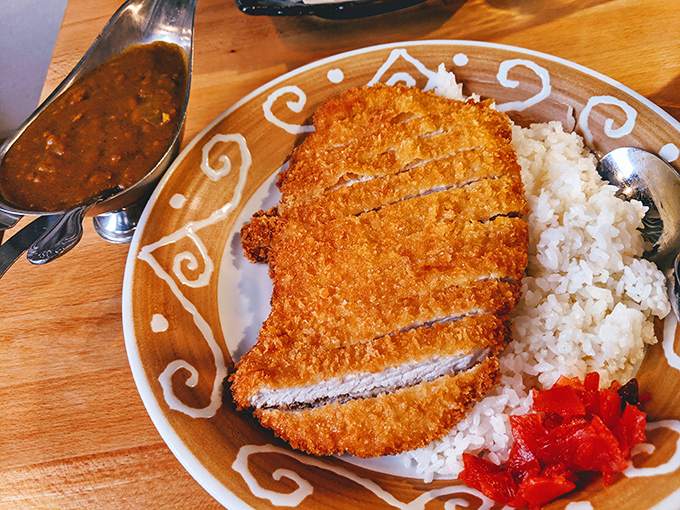 Golden-fried katsu perfection with rice so fluffy it could double as a pillow for tiny food dreams.