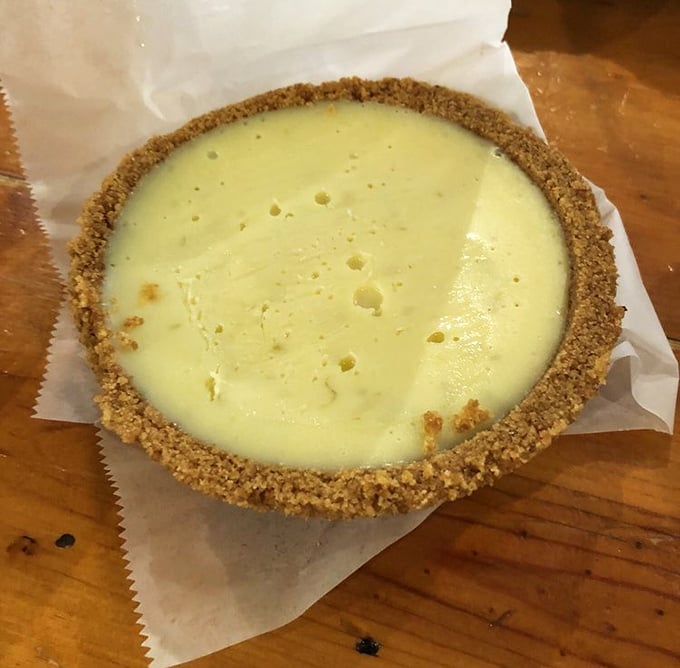 Key lime pie with a graham cracker crust so perfect it makes you wonder if you've been eating dessert wrong your entire life.