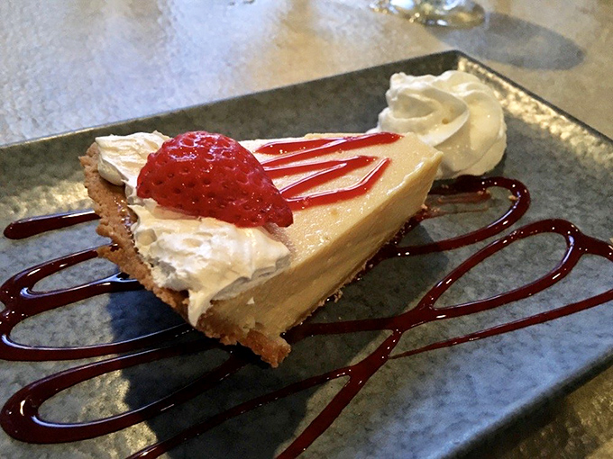 Key Lime Pie that strikes the perfect balance between tart and sweet—Florida's official dessert ambassador topped with a raspberry beret.