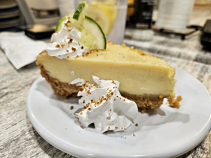 That slice of key lime pie delivers the tangy-sweet punch your taste buds have been craving since you crossed into coastal territory.