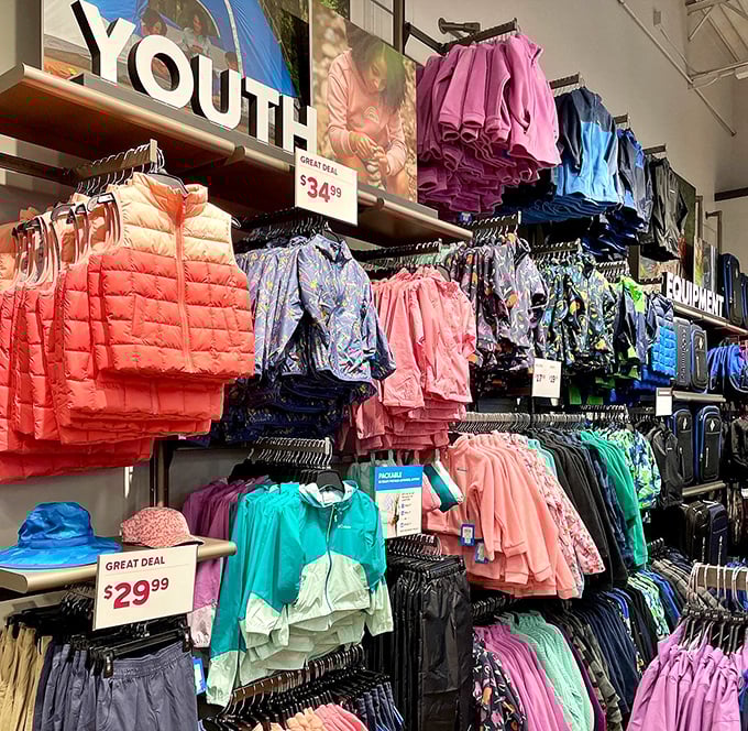 The youth section explodes with color like a kindergarten finger-painting session. Those coral jackets practically scream "Buy me for your growing child!"