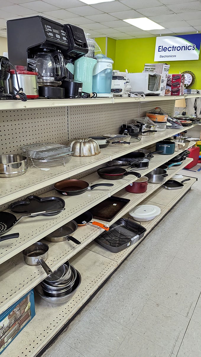 Cast iron skillets and coffee makers stand at attention, waiting for their second act in someone else's culinary adventures.