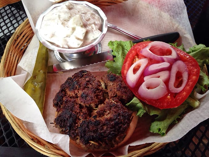 The blackened lamb burger arrives with all the fanfare it deserves&mdash;juicy, perfectly seasoned, and ready for its close-up with those vibrant red onions.