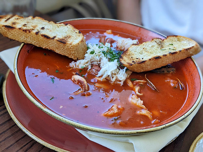Cioppino: San Francisco's seafood democracy where crab, shrimp, and fish swim together in tomato broth harmony.