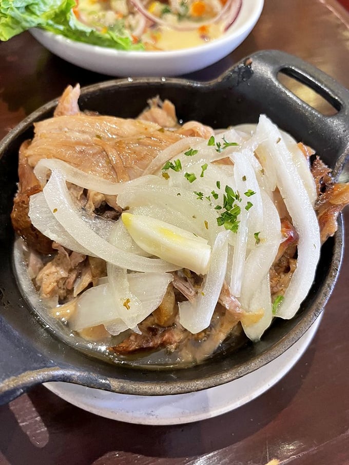 Lechon asado with those glistening onions is the kind of dish that makes conversation stop and eyes close in silent appreciation of pork perfection.