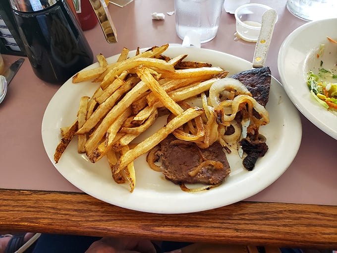 Liver and onions &ndash; the dish that separates casual diners from true comfort food aficionados &ndash; served with perfect golden onions.