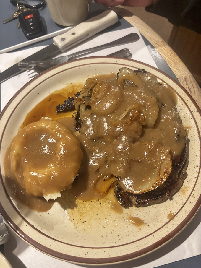 Comfort food that your grandmother would approve of—tender meat swimming in rich gravy. This plate doesn't need filters or fancy lighting to impress.