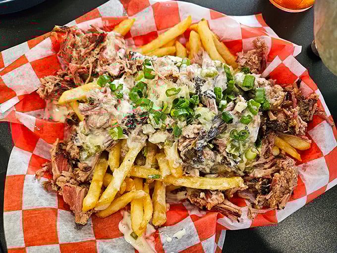French fries living their best life, smothered in pulled meat and green onions. Diet plans, consider yourselves officially postponed.