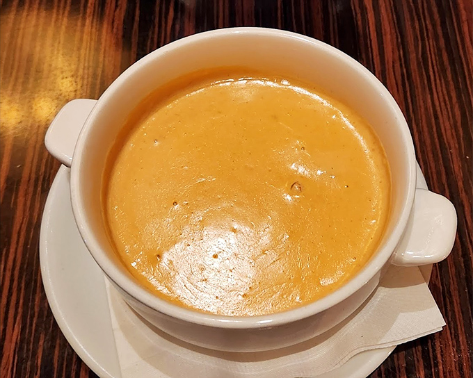 This lobster bisque isn't just soup; it's a velvety ocean of flavor that makes you wonder why you'd ever order anything else.
