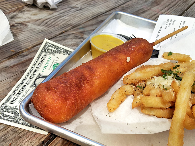 The lobster corn dog defies culinary categories in the best possible way, like if Mozart decided to write a country song that somehow won a Grammy.