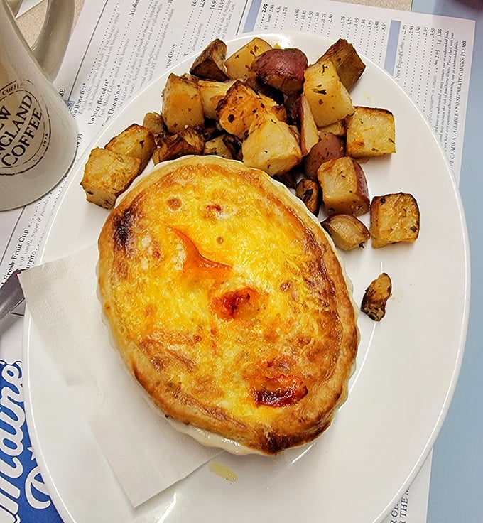 That golden-brown crust on the lobster quiche hints at the treasure trove of seafood waiting beneath its flaky surface.