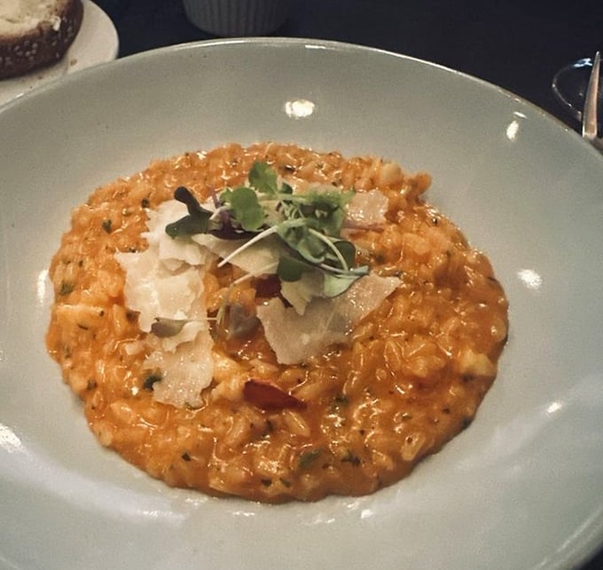 This isn't just risotto; it's a creamy canvas of comfort food elevated to art form status. The kind that makes you close your eyes with each bite.