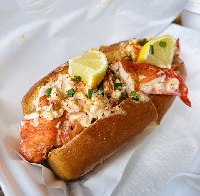 The lobster roll &ndash; a buttery, toasted vessel carrying sweet lobster meat to your mouth. Those lemon wedges aren't just for show, folks.