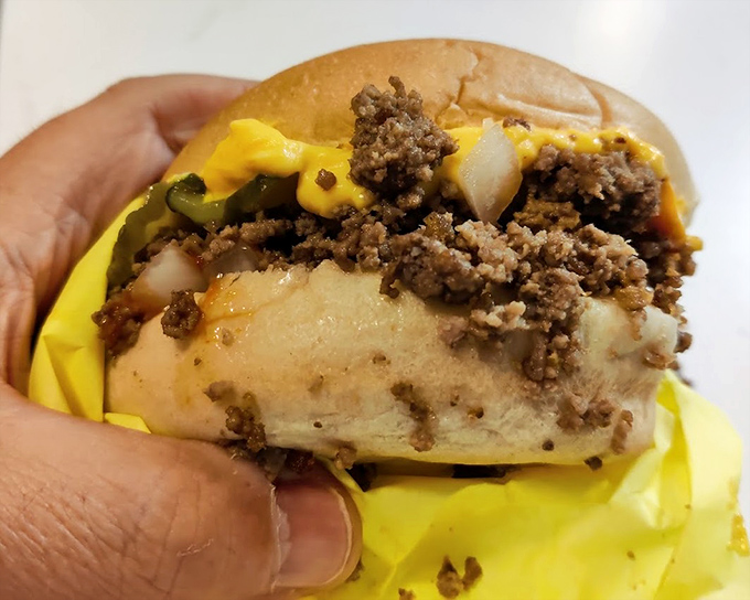 The famous loose meat sandwich in its natural habitat, wrapped in yellow paper and ready to test your napkin supply.