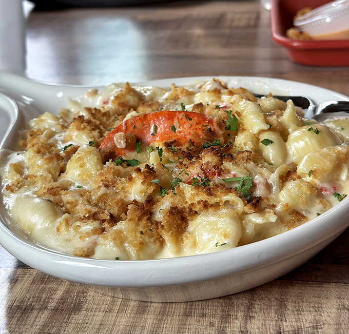 Lobster mac and cheese topped with a whole crustacean because sometimes regular mac and cheese just isn't living up to its potential.