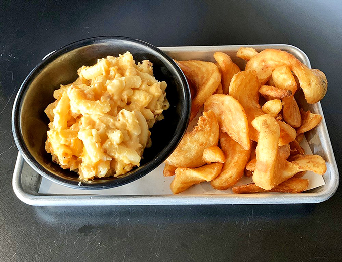 Mac and cheese that achieves the perfect balance between creamy and structured, like a dairy-based architectural marvel. Those potato wedges aren't just sidekicks.