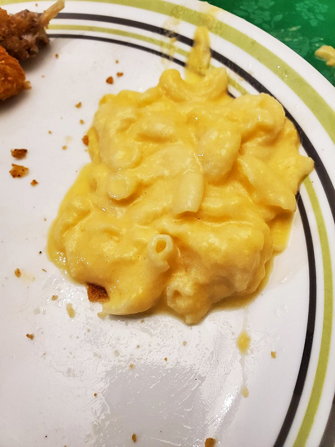 Mac and cheese that doesn't just sit on your plate&mdash;it demands attention with its vibrant color and creamy texture. Comfort in every forkful.