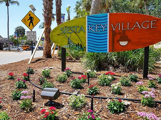 The colorful surfboard welcome sign to Siesta Key Village, where beach vibes meet culinary delights just steps from paradise.