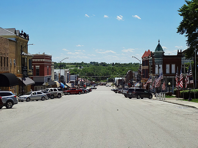 Main Street slopes gently downward, revealing the rolling countryside beyond&mdash;a daily reminder that nature is never far in Corning.