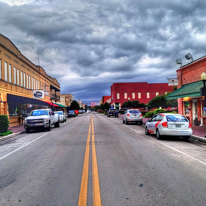 Main Street after a rain shower reflects the warm glow of historic storefronts. Small-town America doesn't get more picture-perfect than this twilight scene.