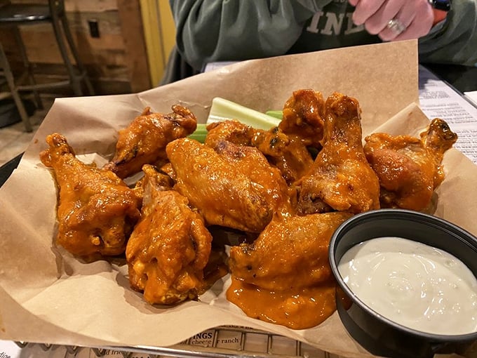 These wings don't fly&mdash;they soar straight into flavor heaven, their bright orange coating a warning sign that delicious heat lies ahead.