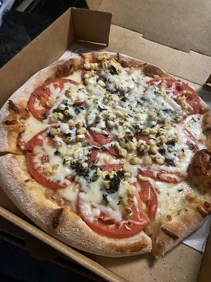 Fresh tomatoes on a perfect crust&mdash;sometimes the simplest combination speaks the most profound culinary truth.