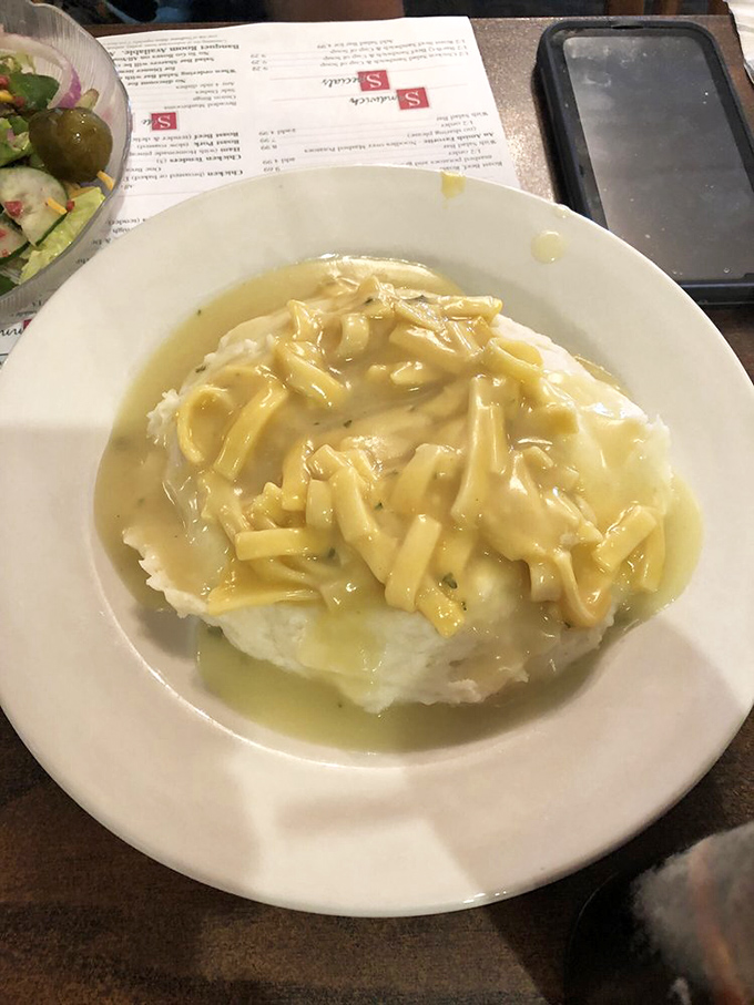 Chicken and noodles over mashed potatoes&mdash;because sometimes one carb simply isn't enough to achieve true Midwestern bliss.