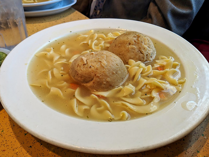 Matzo ball soup that could heal whatever ails you. Those golden orbs floating in clear broth are like comfort in edible form.