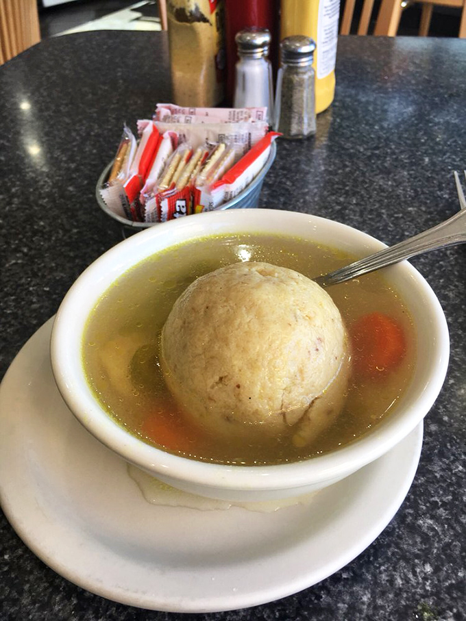 The matzo ball soup &ndash; where a golden-hued broth cradles what can only be described as the dumpling equivalent of a perfect hug.