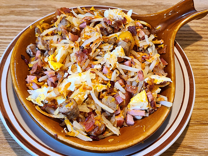 The skillet that launched a thousand naps. Eggs, potatoes, meat, and cheese performing the kind of harmony that boy bands can only dream about.