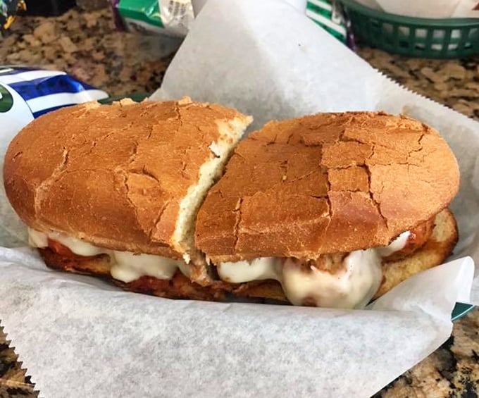 The humble meatball sub elevated to art form&mdash;where marinara-soaked bread cradles perfectly seasoned spheres of meaty goodness under a blanket of molten cheese.