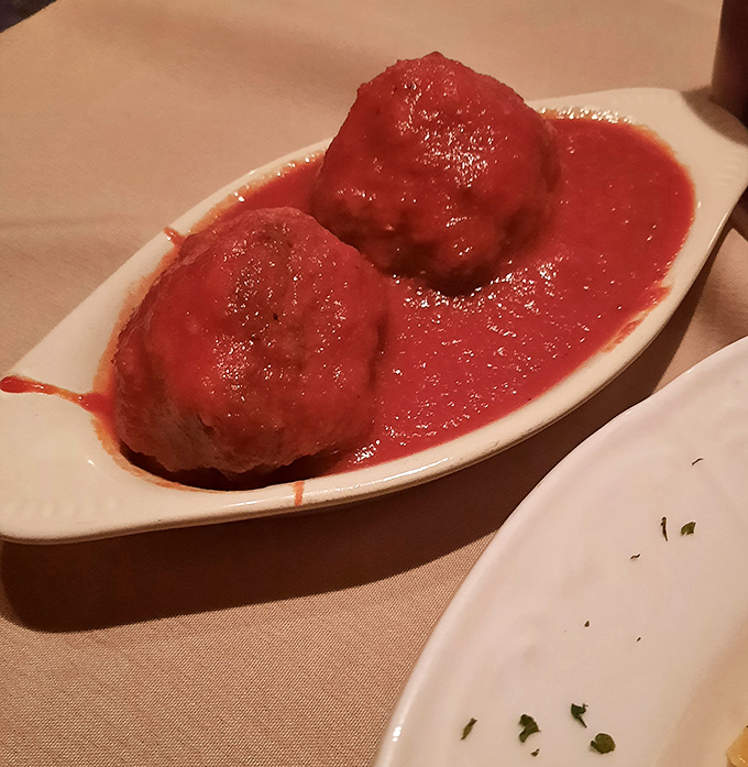 These aren't just meatballs&mdash;they're edible time machines transporting you to an Italian grandmother's Sunday dinner table.