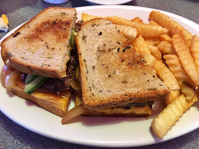 A sandwich that demands to be eaten with both hands and plenty of napkins. The structural integrity alone deserves an engineering award.