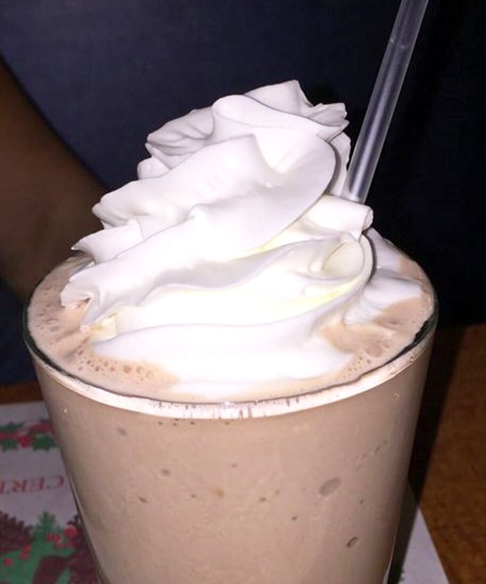 Frothy milkshake topped with a cloud of whipped cream&mdash;the kind that makes you wonder why anyone bothers with fancy desserts when classics exist.